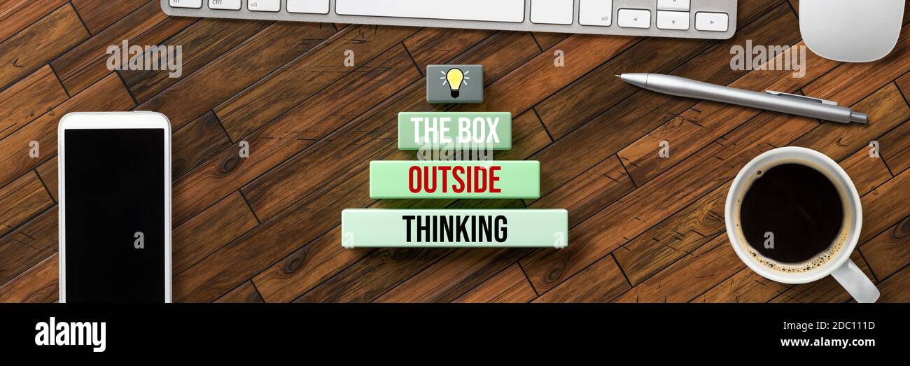 boxes with text THINKING OUTSIDE THE BOX amd computer equipment on ...