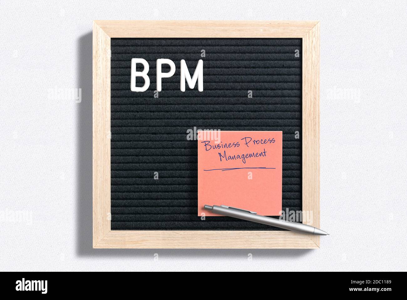 letter board with BPM and note with message BUSINESS PROCESS MANAGEMENT ...