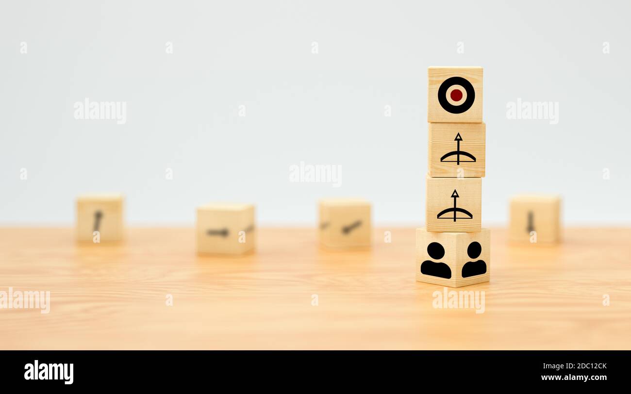 stacked cubes with arrow symbols pointing towards a target on white ...