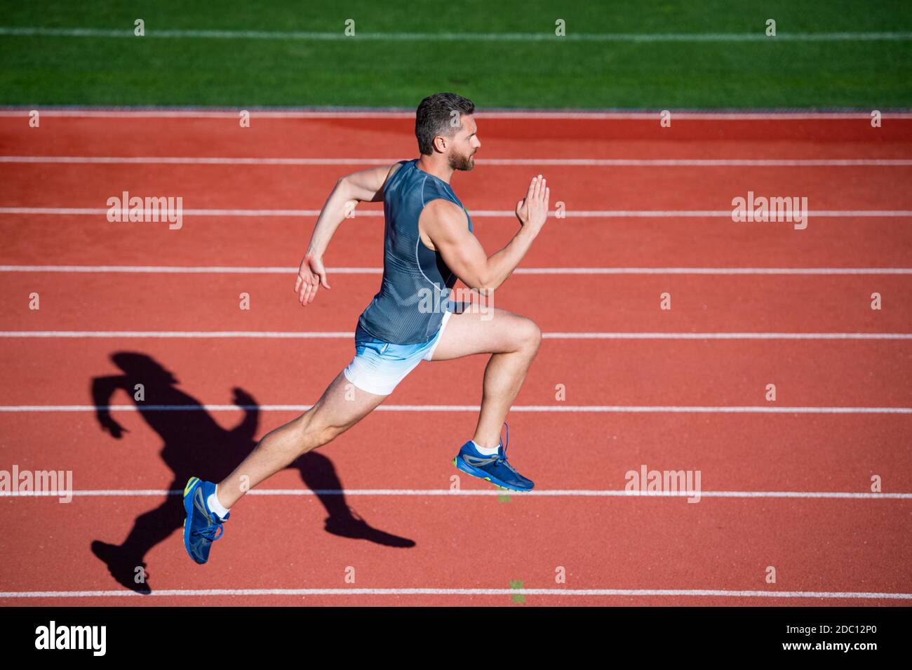 Athlete running fast track coach hi-res stock photography and images ...
