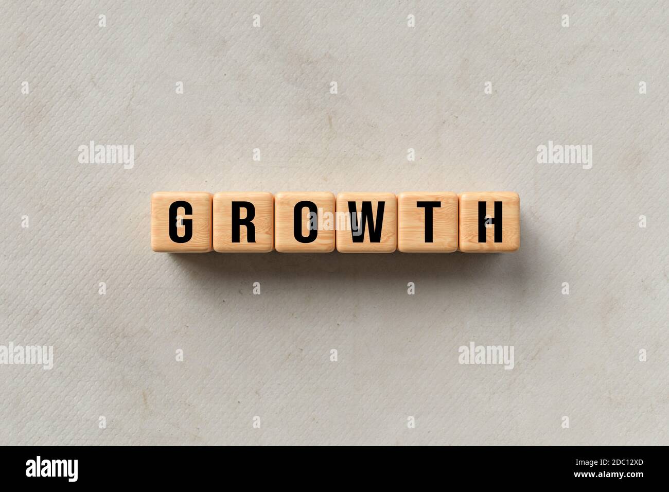 wooden blocks with the word GROWTH on paper background - 3d ...
