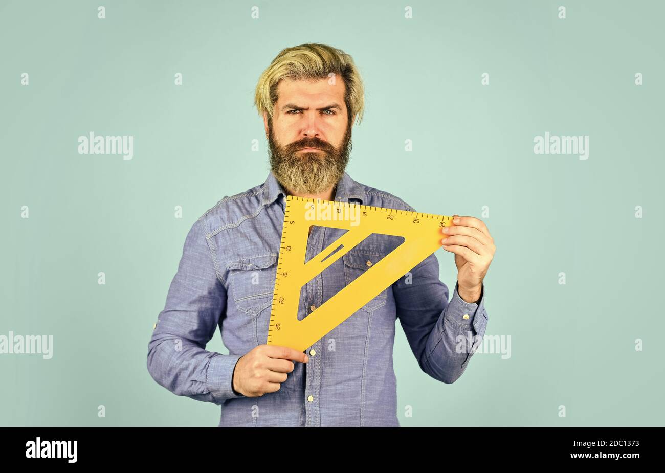 Education. man teacher use triangle tool. bearded tutor man with ruler ...