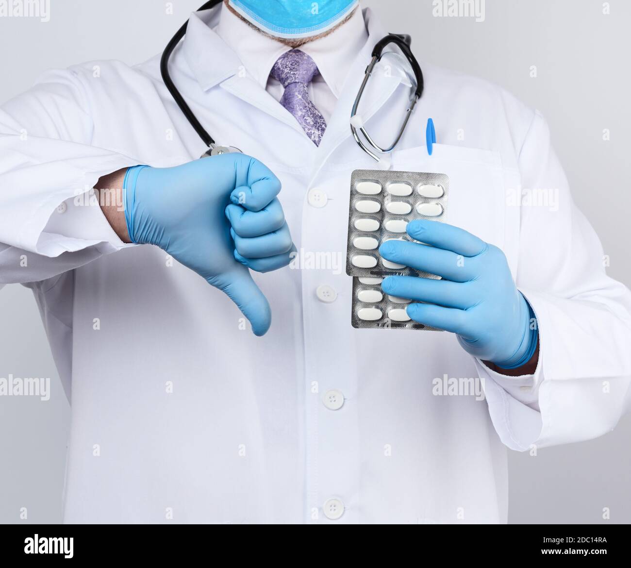 adult doctor therapist is dressed in a white uniform coat and blue ...