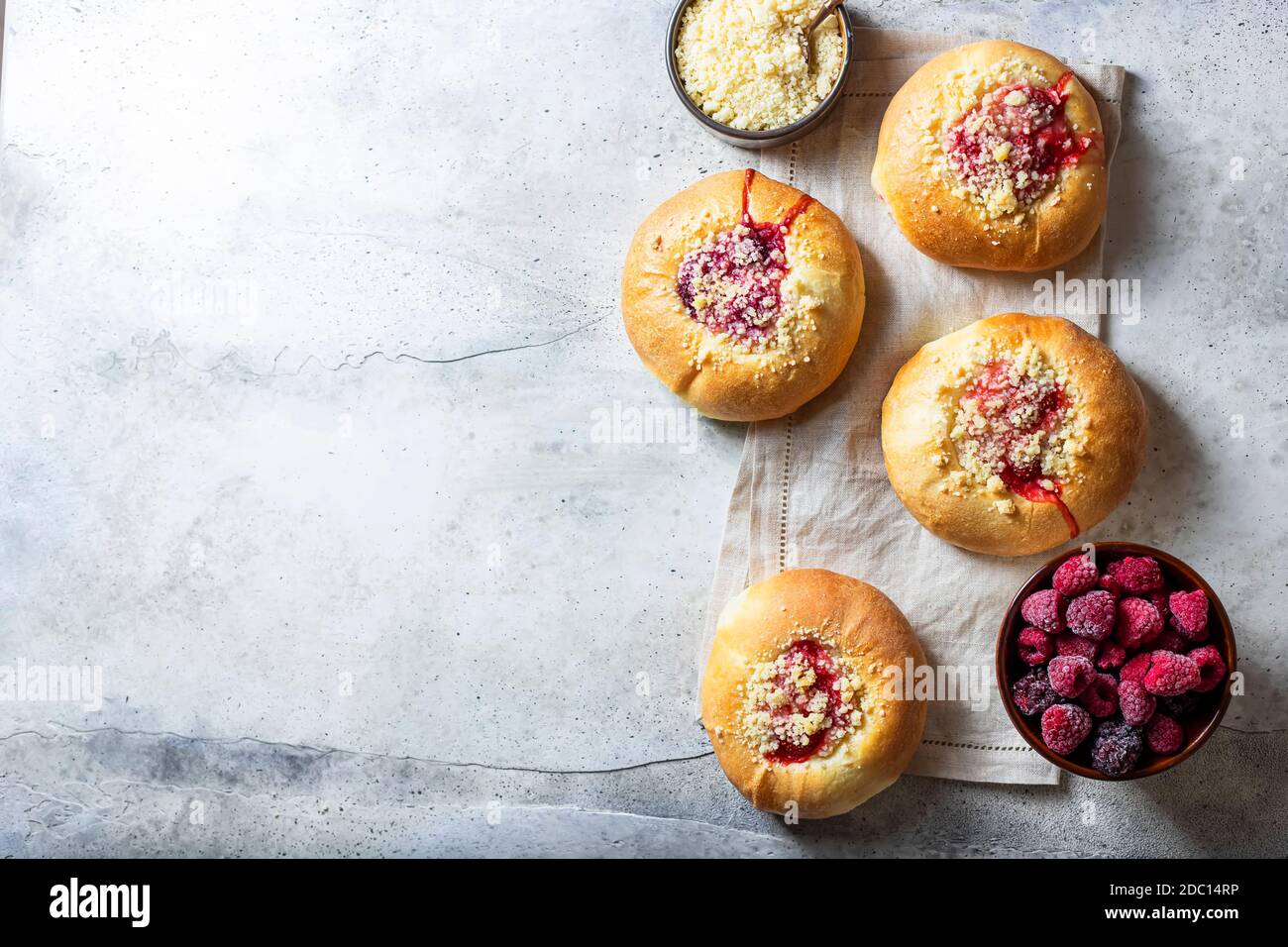 Homemade Sweet Yeast Buns filled with Berry and with crumble. Concrete ...