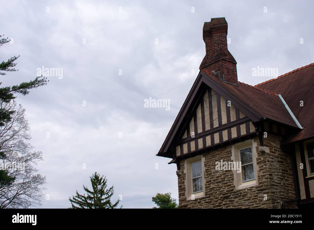A Detailed and Ornamental Cobblestone Building With a Red Roof Stock ...