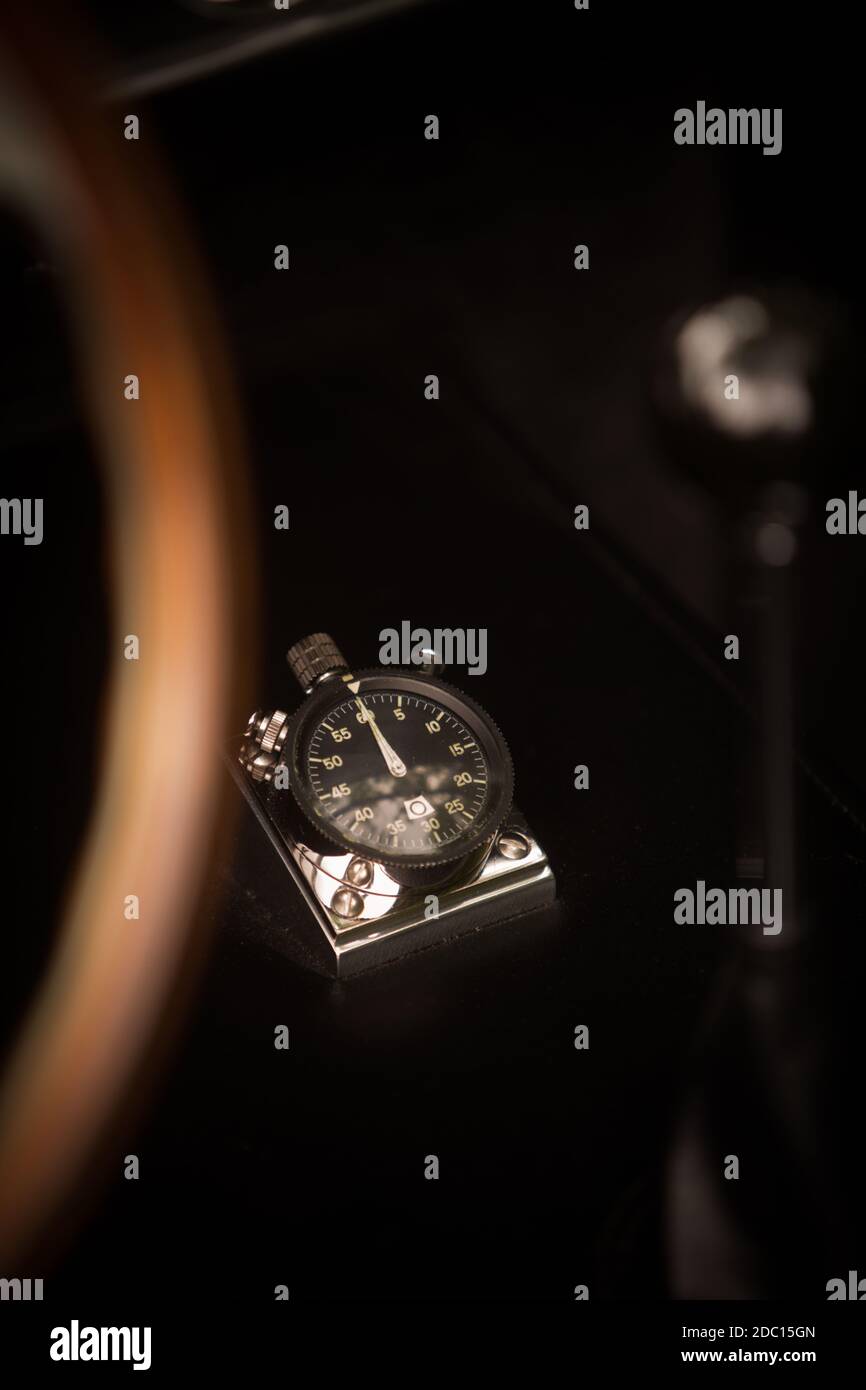 Close up shot of a vintage stopwatch inside a race car Stock Photo - Alamy