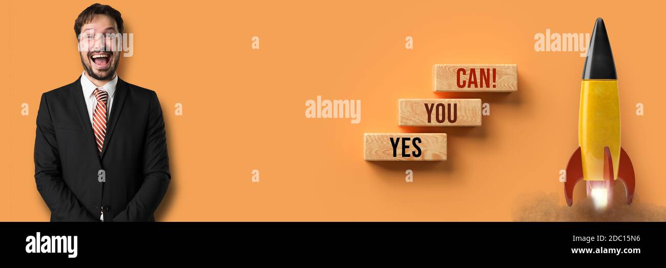 happy businessman and cubes with message OH YES, YOU CAN on orange ...