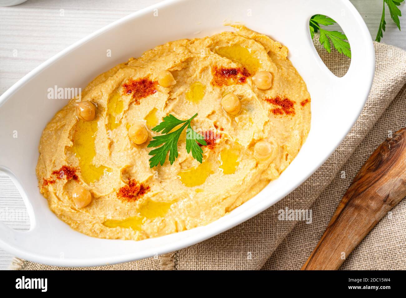 hummus paste with lemon and chilli on white background Stock Photo - Alamy