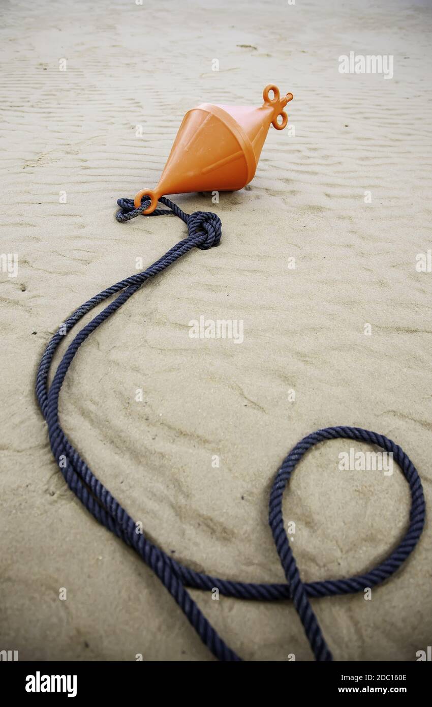 Buoy on sand beach, tourist landscape, sea and nature Stock Photo - Alamy