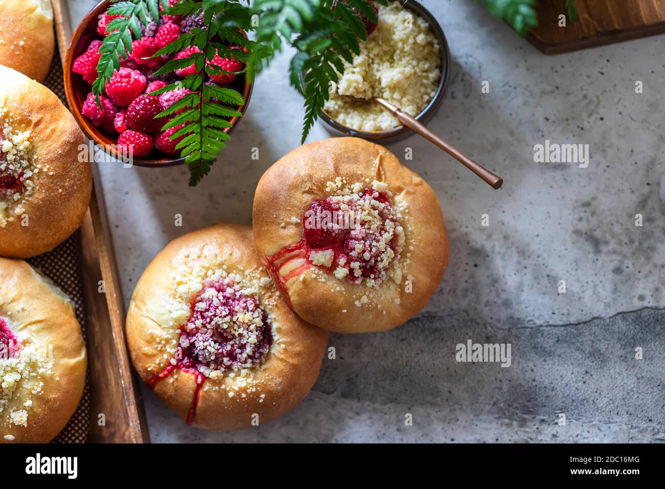 Homemade Sweet Yeast Buns filled with Berry and with crumble. Concrete ...