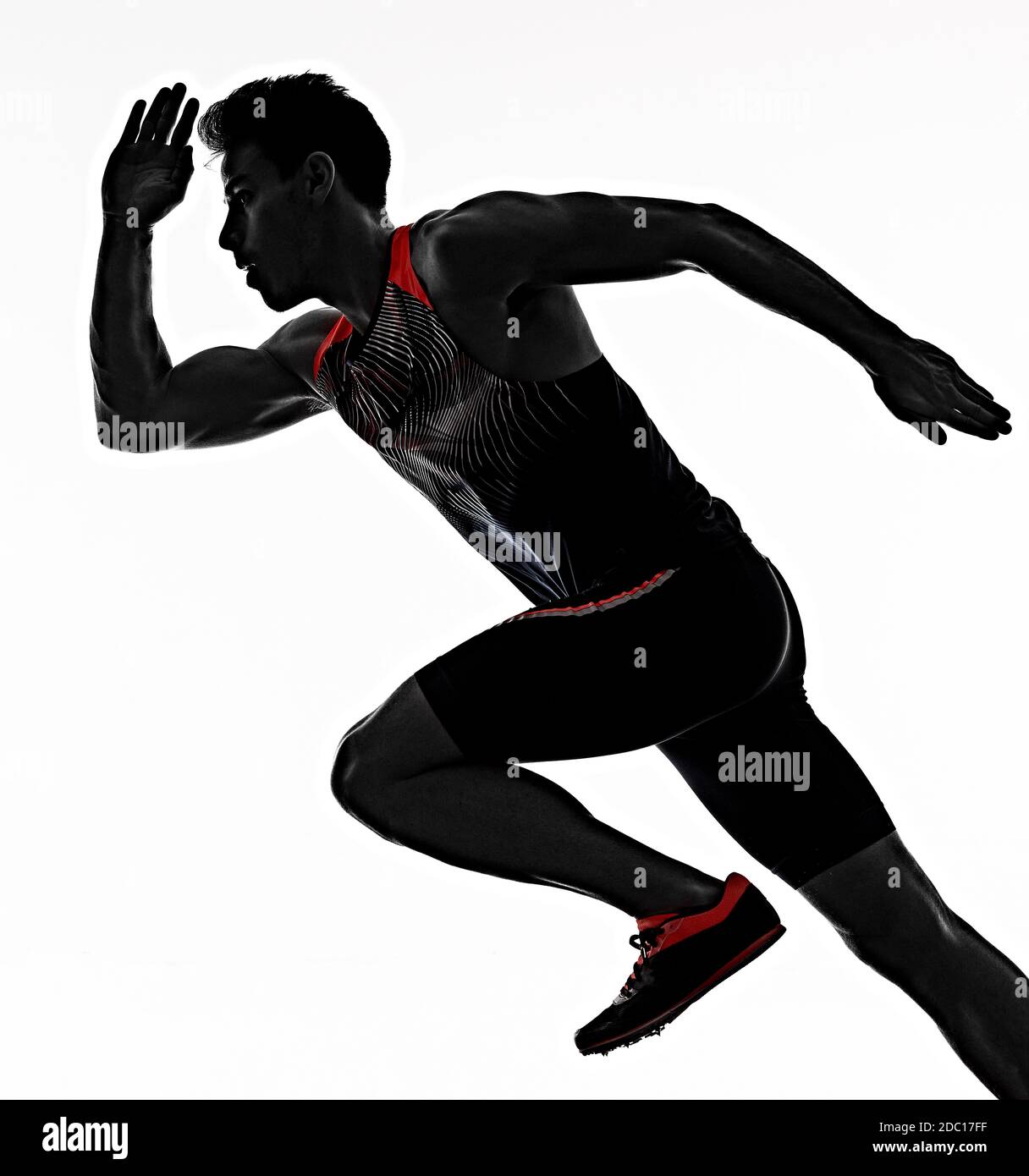 one young caucasian man practicing athletics runner running sprinter ...