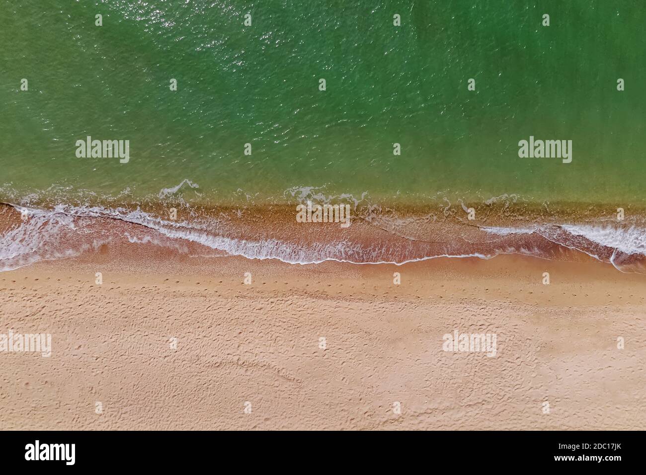 Aerial top view of the beach with sand and small waves Stock Photo - Alamy