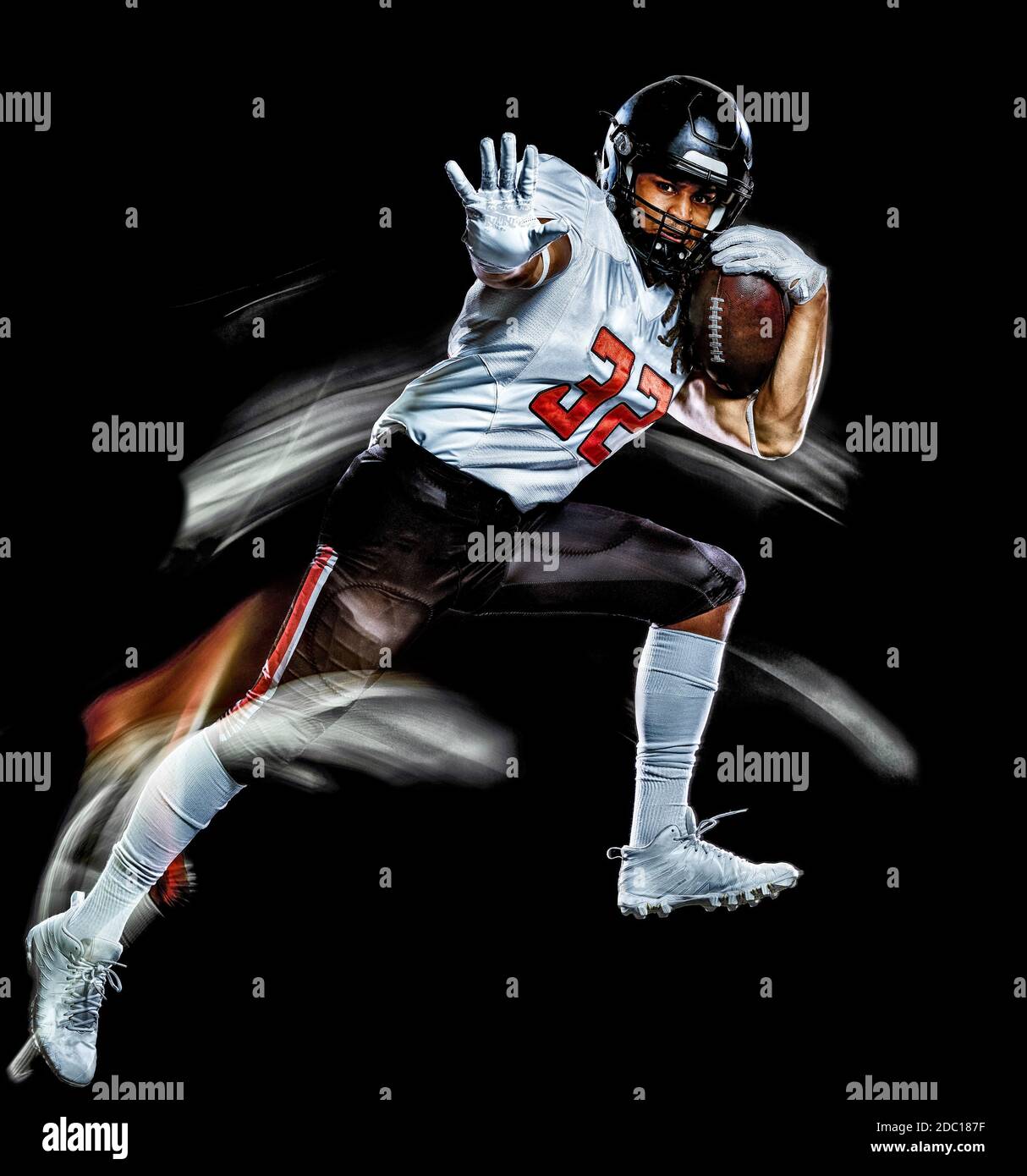 one african american football player man studio shot isolated on black ...