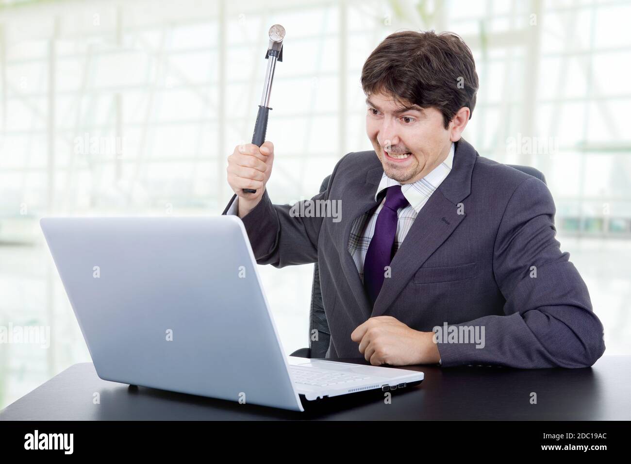Man smashing computer with hammer hi-res stock photography and images ...