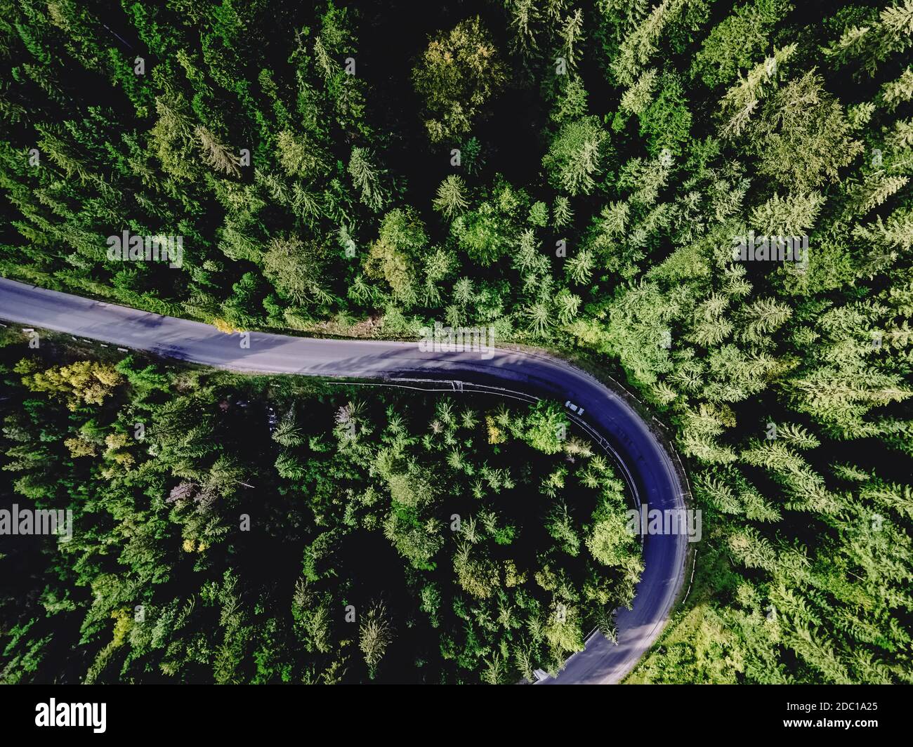 Aerial top view of curvy mountain road Stock Photo - Alamy