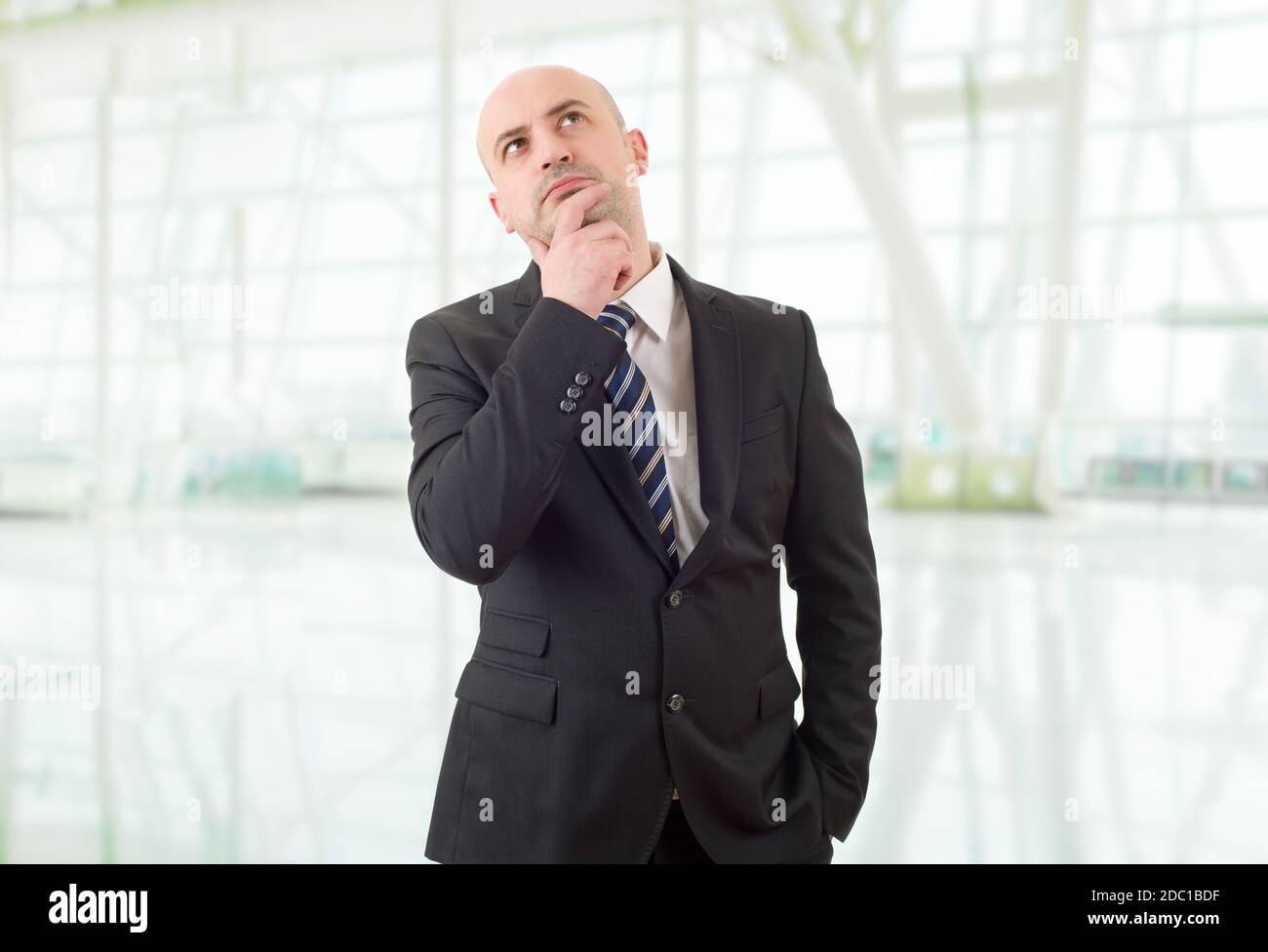 young business man thinking, at the office Stock Photo - Alamy