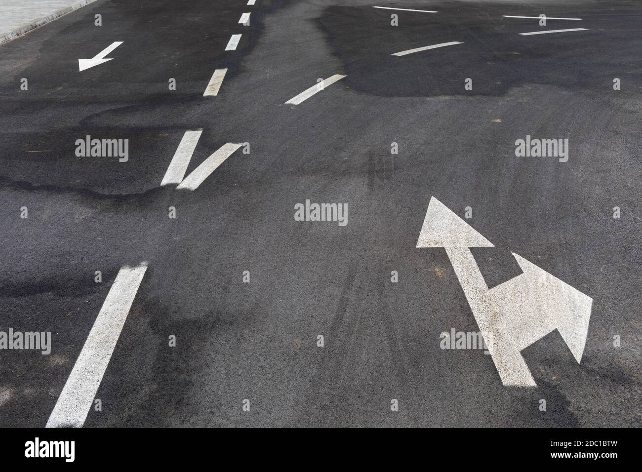 Directional Arrows at Two Way Street Tarmac Stock Photo - Alamy