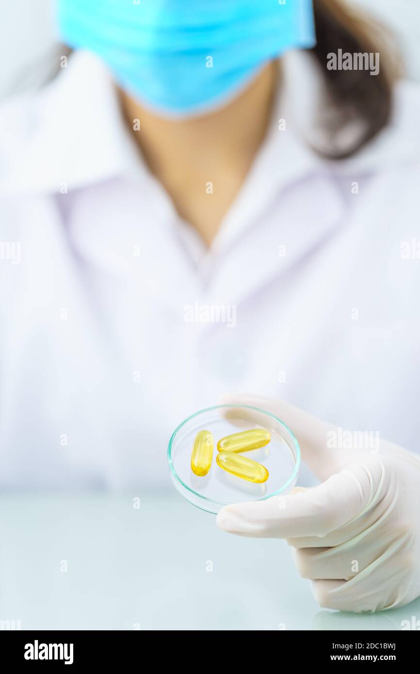 Close up Scientist hands putting in nitrile latex gloves holding Omega ...