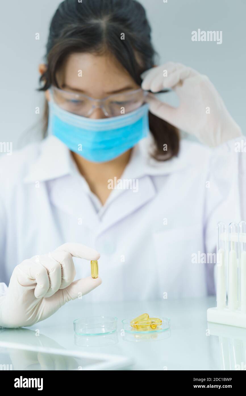 Close up Scientist hands putting in nitrile latex gloves holding Omega ...
