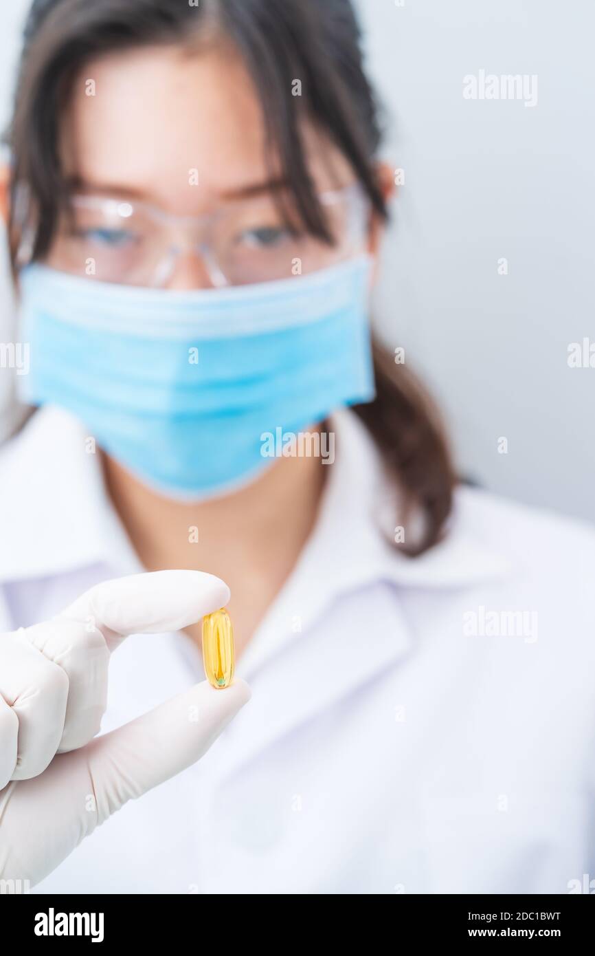 Close up Scientist hands putting in nitrile latex gloves holding Omega ...