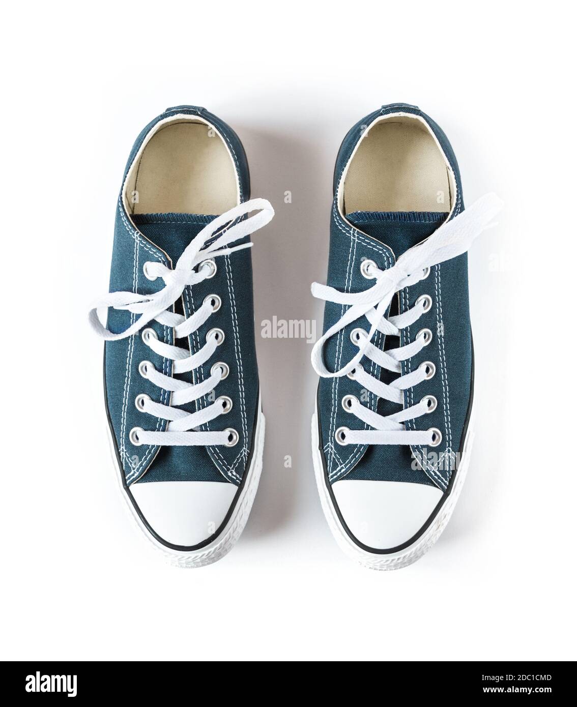 Blue generic sneakers isolated on white background Stock Photo - Alamy