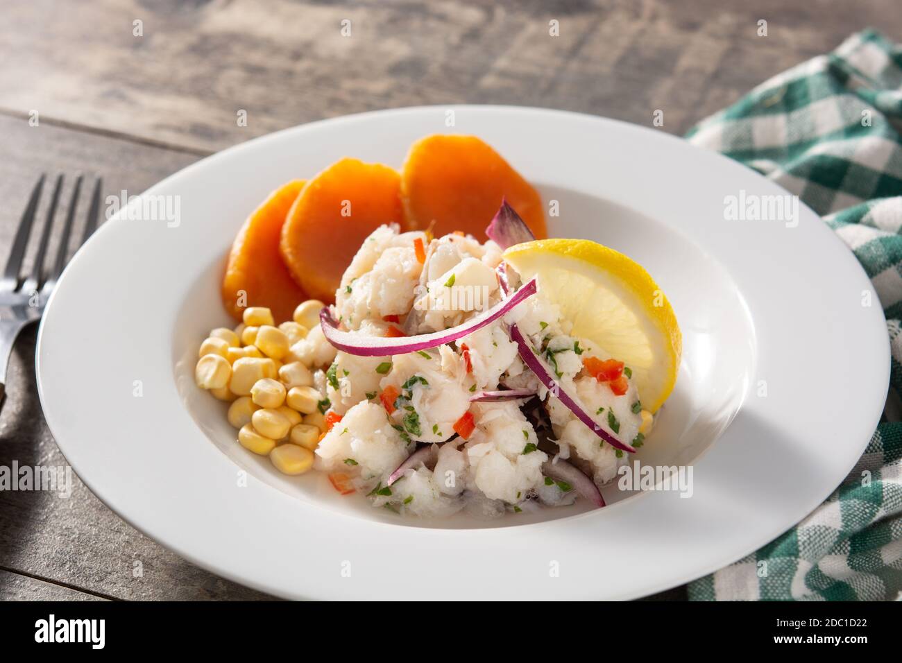Traditional peruvian ceviche with fish, sweet potato, corn and ...
