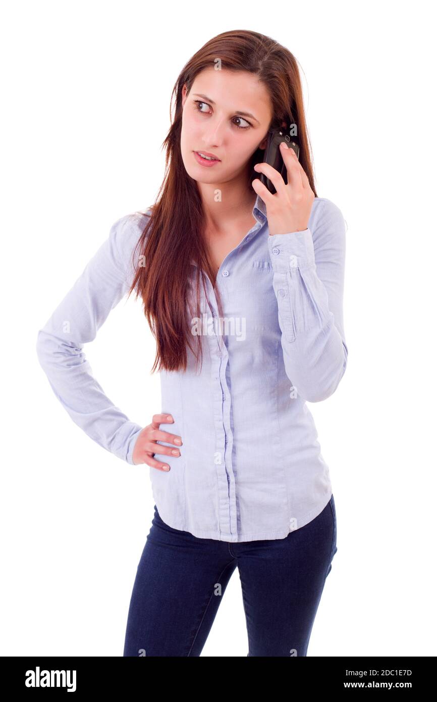 worried beautiful woman at the phone, isolated over a white background ...