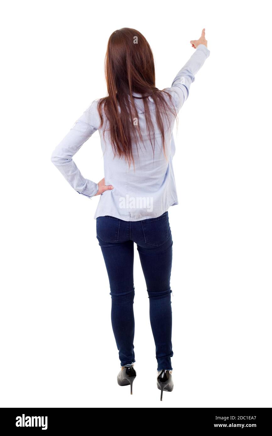 young casual woman full body, pointing, isolated on a white background ...