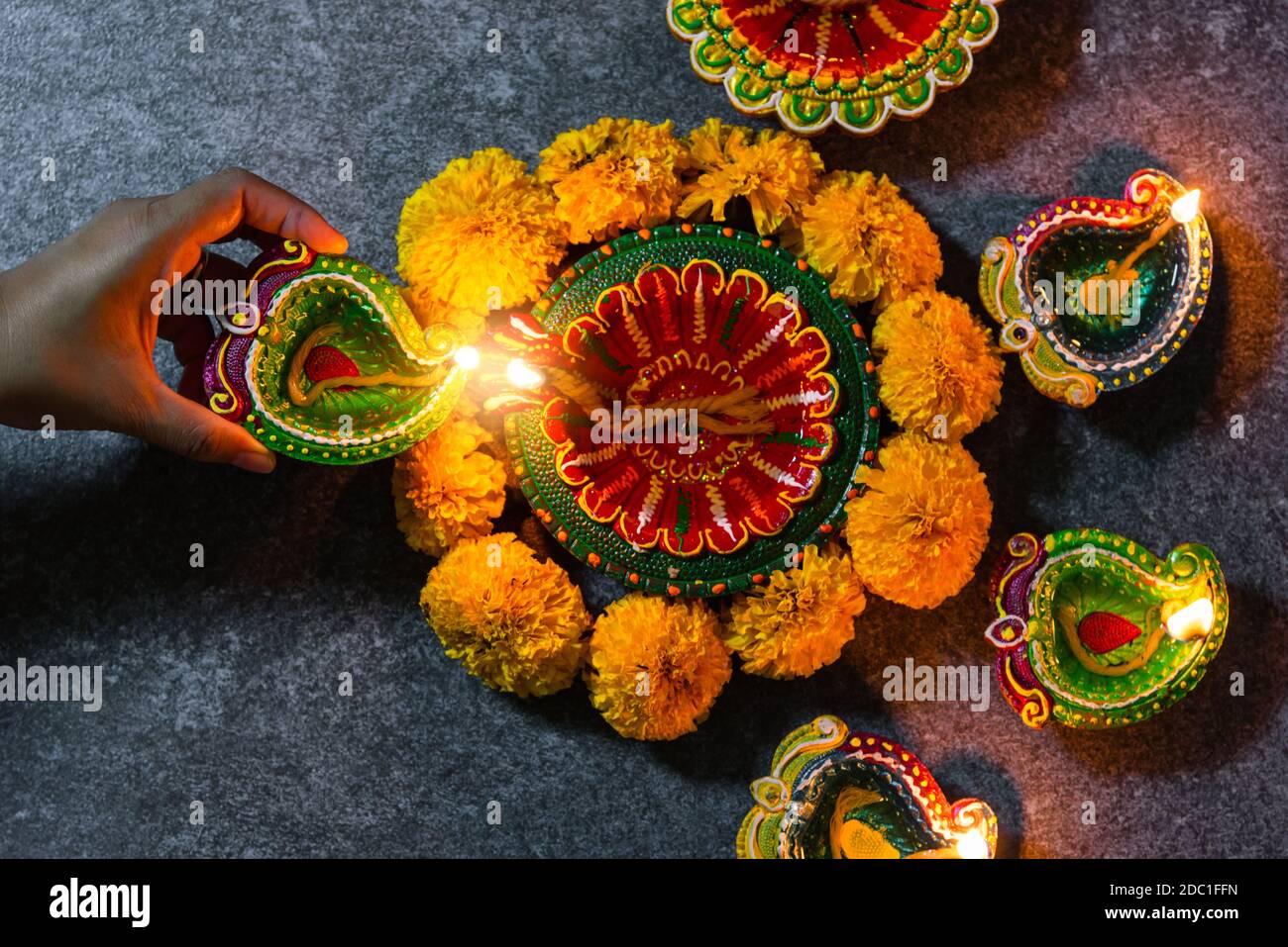 India diwali rangoli woman hi-res stock photography and images - Alamy