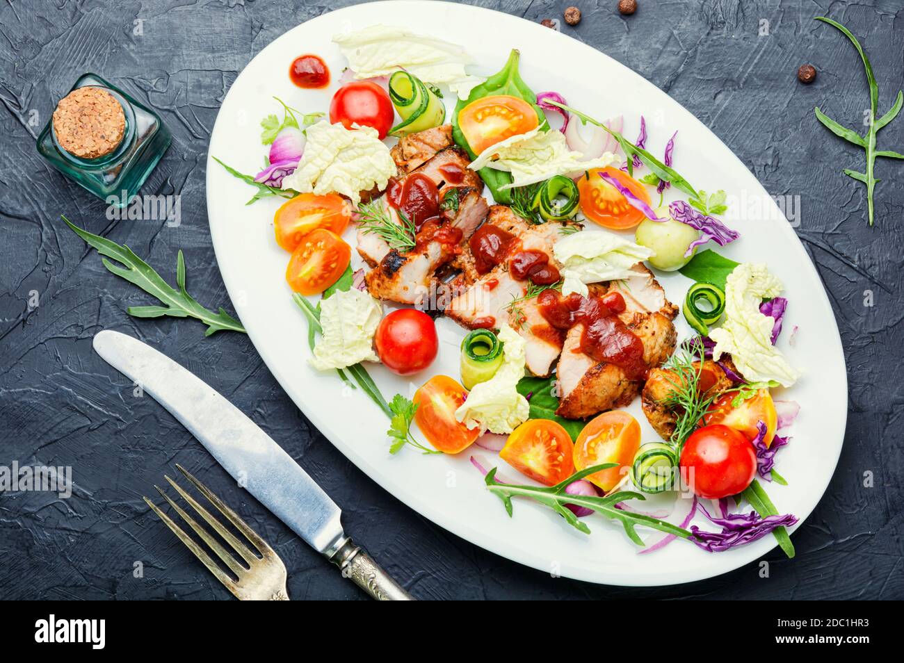 Delicious salad with tomato,cucumber,lettuce and meat steak.Healthy ...