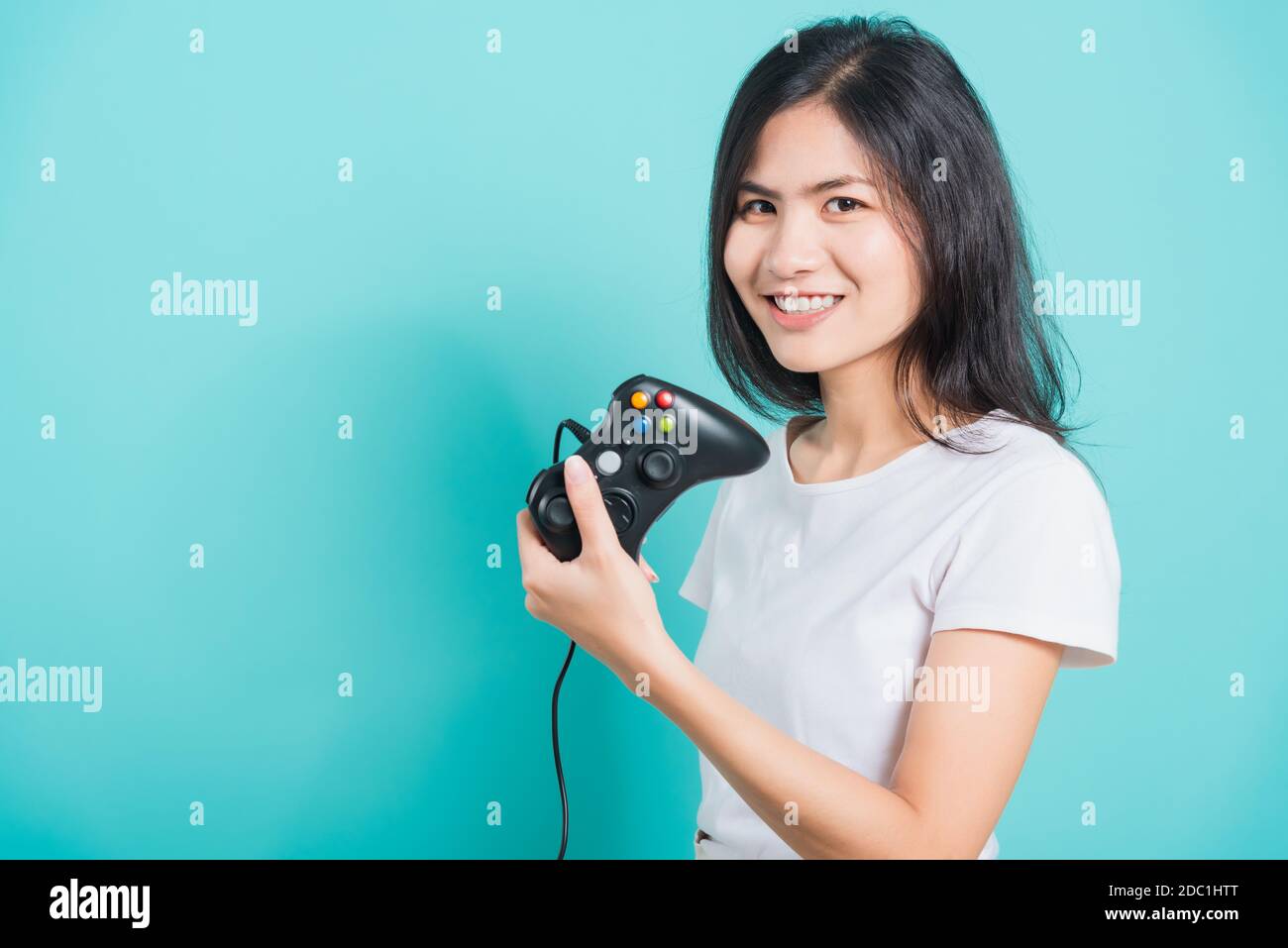 Portrait Asian beautiful happy young woman wear t-shirt gamer with a ...