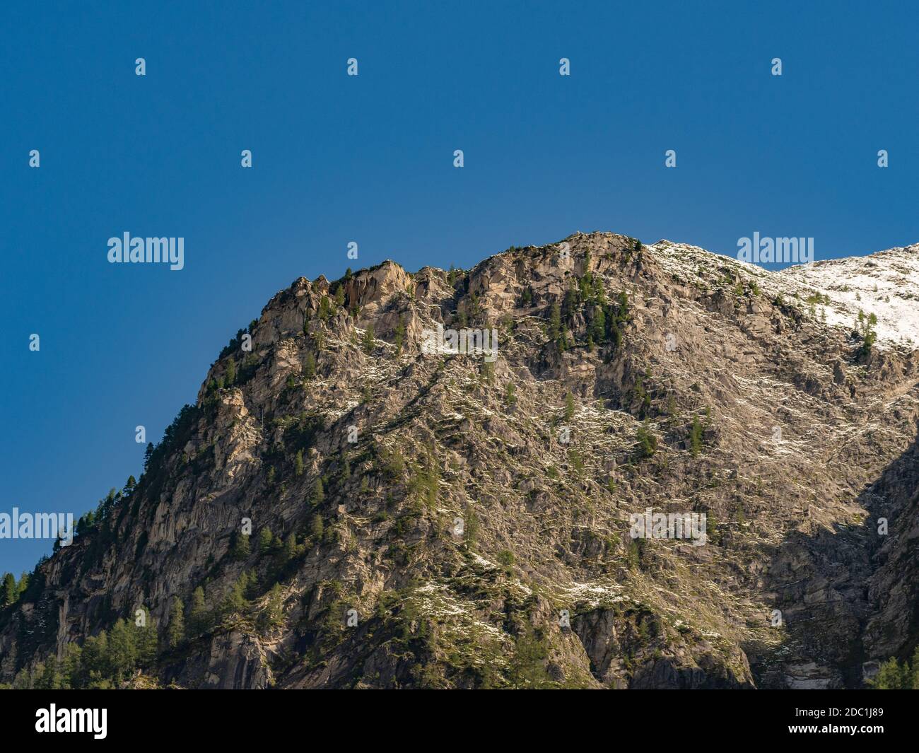 Rock formation in alps and blue sky Stock Photo - Alamy