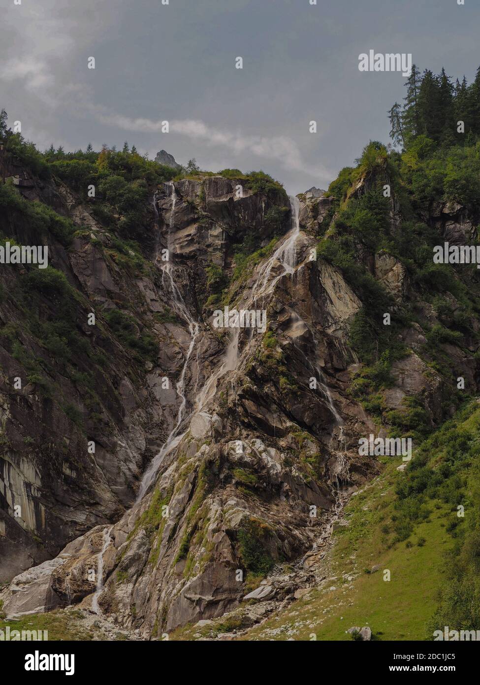 High waterfall in mountain area Stock Photo - Alamy