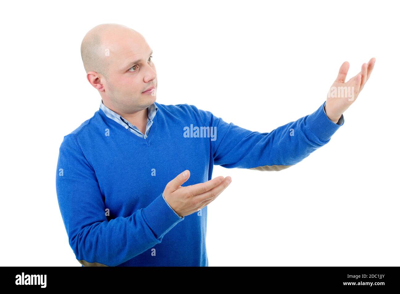young man pointing to his side, isolated on white background Stock ...