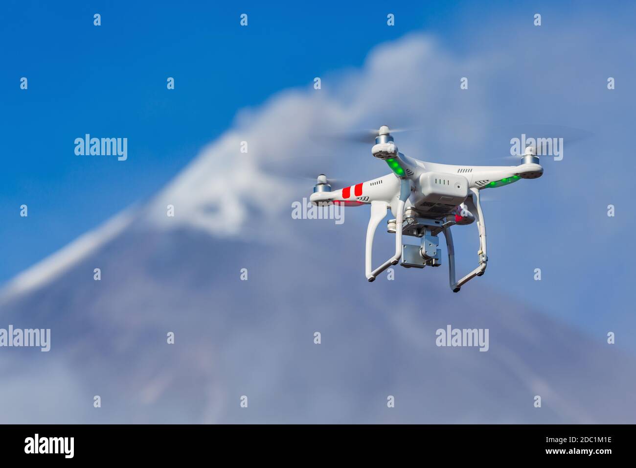 Flying drone quadcopter UAV aerial photography in sky on background ...