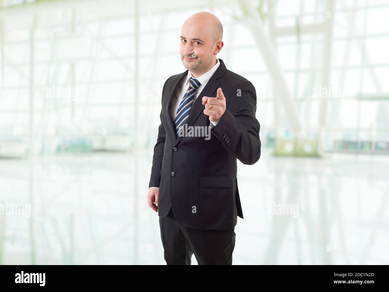 happy business man pointing, at the office Stock Photo - Alamy