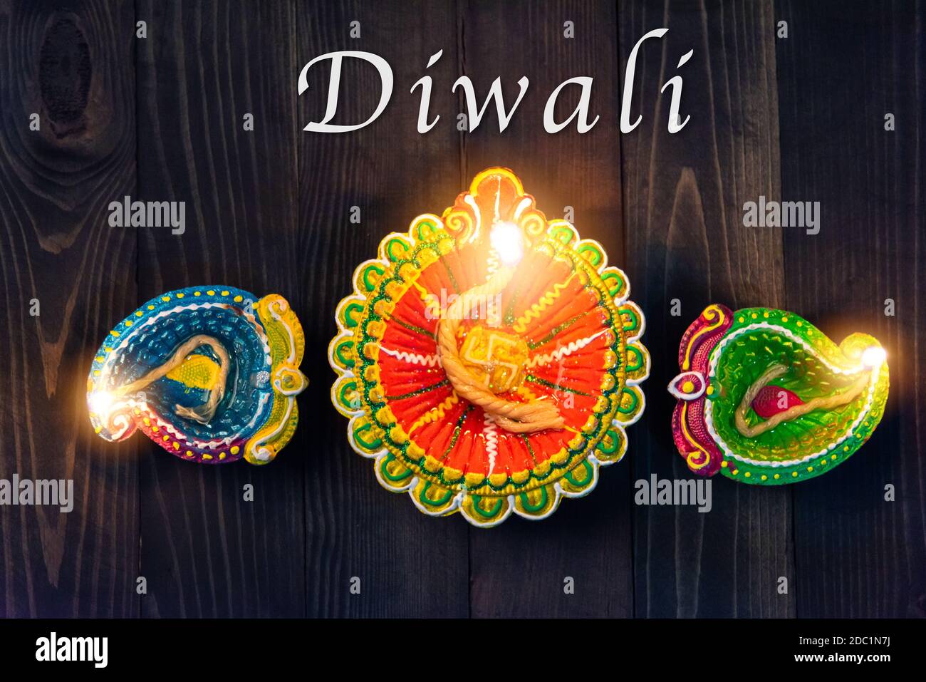 Top view overhead clay lit light a fire already on Diya or oil lamp ...