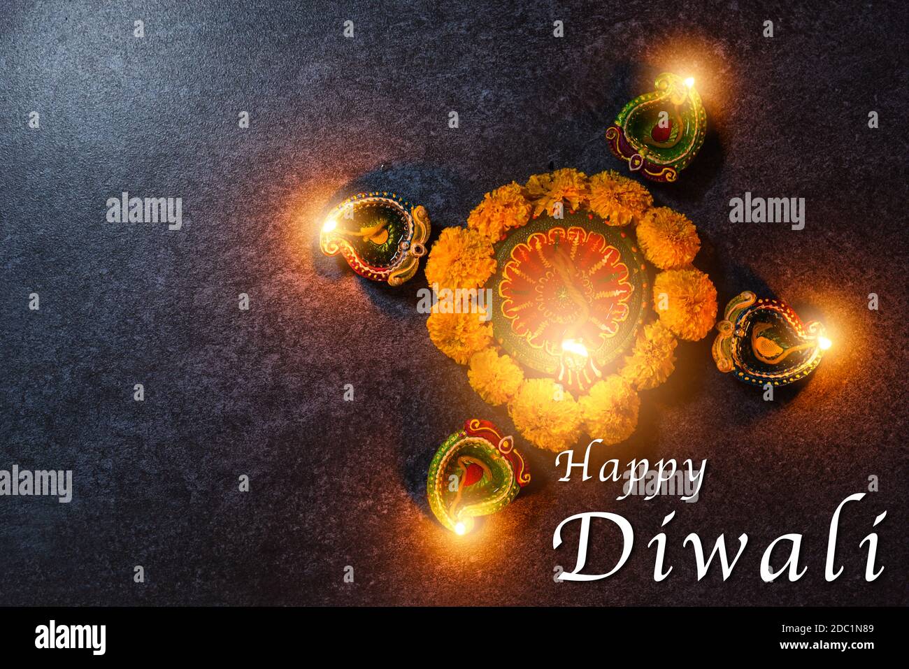 Top view overhead clay lit light a fire already on Diya or oil lamp and ...