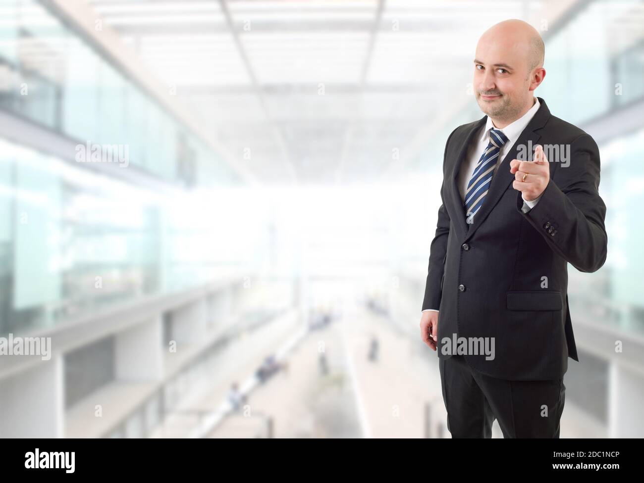 happy business man pointing, at the office Stock Photo - Alamy