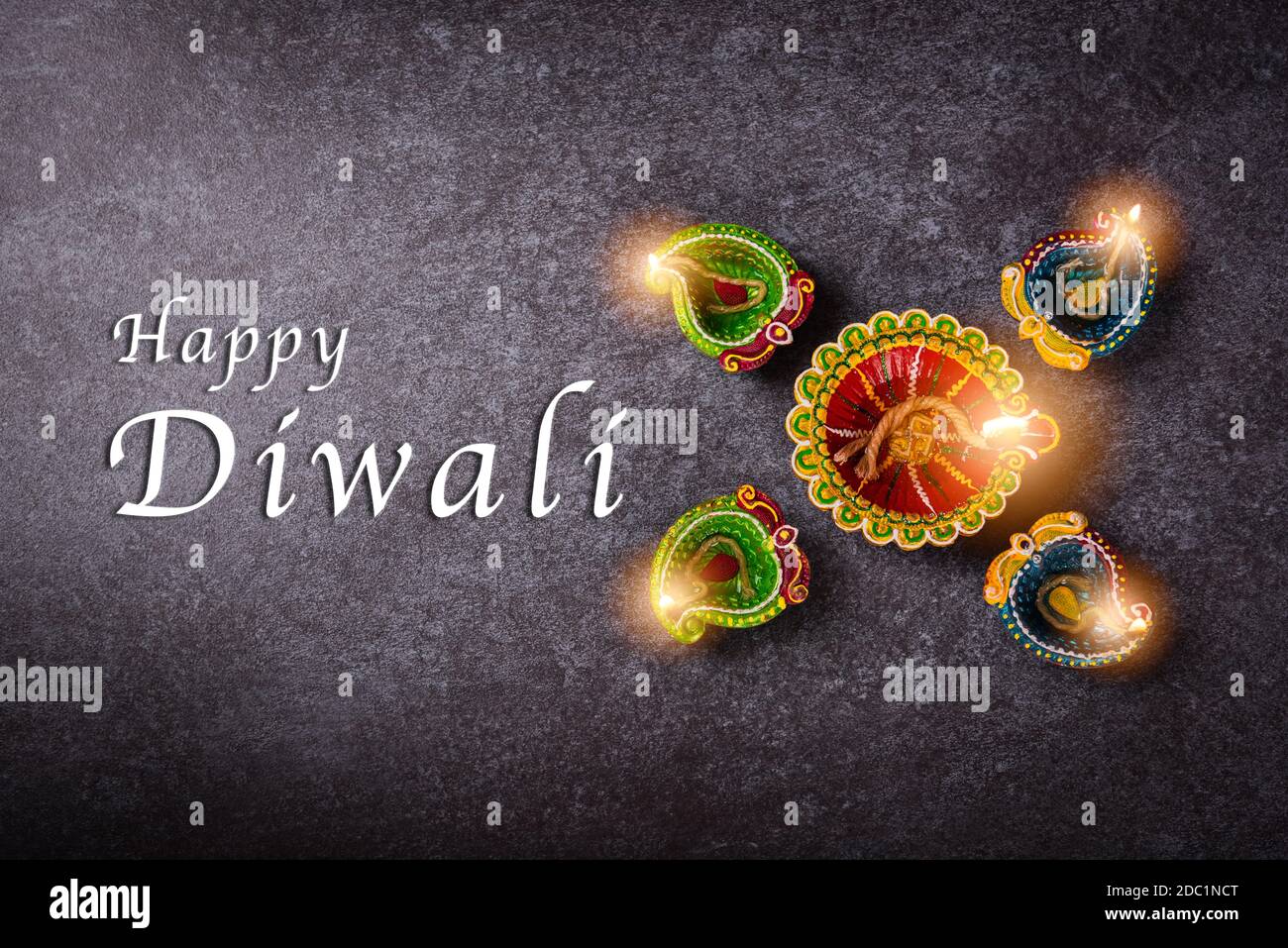 Top view overhead clay lit light a fire already on Diya or oil lamp ...