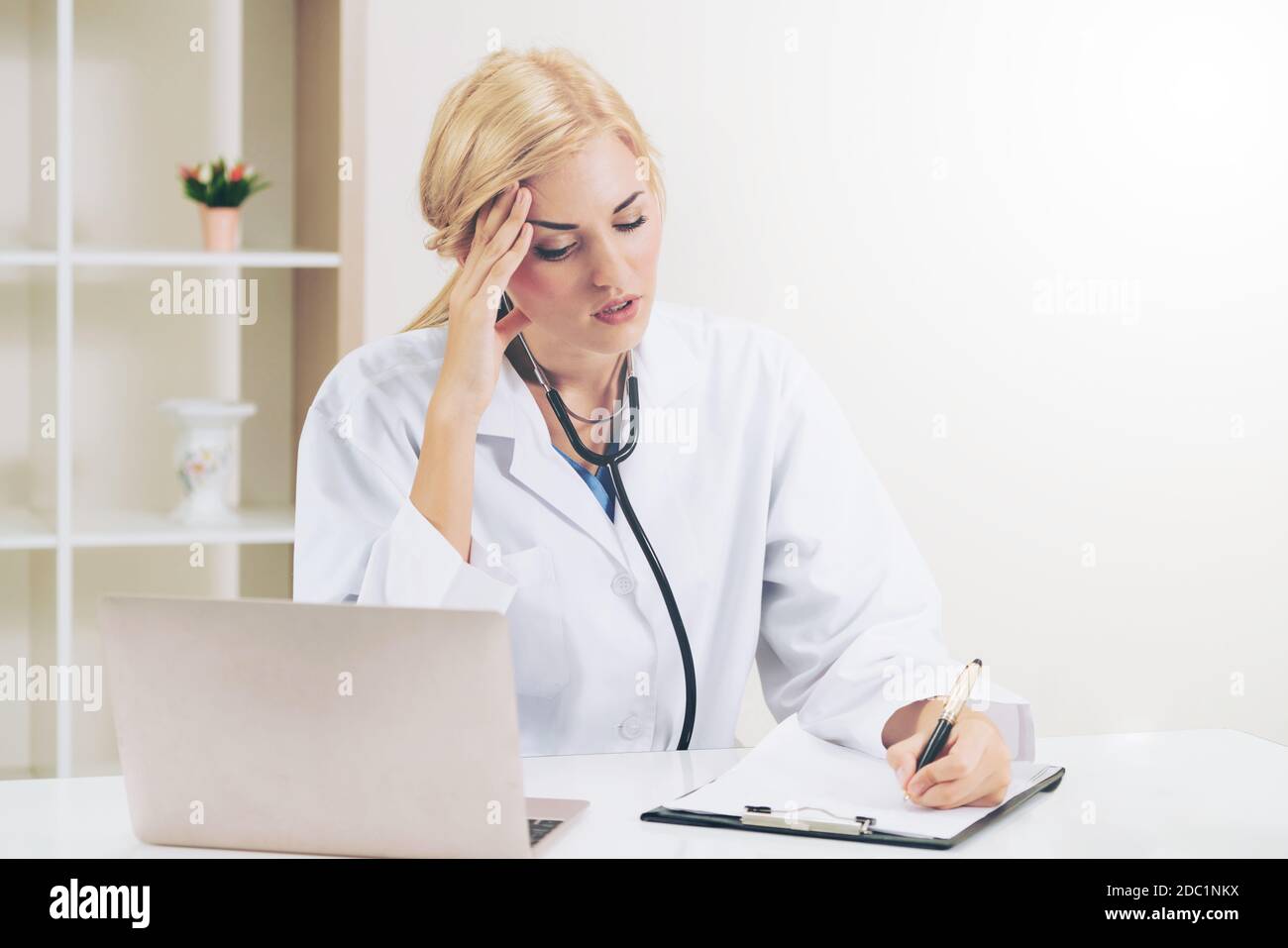 Serious doctor working in hospital office. Medical and healthcare ...