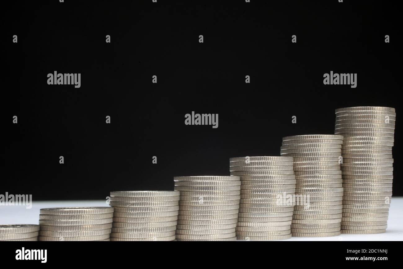 Stacks of money coins Stock Photo - Alamy