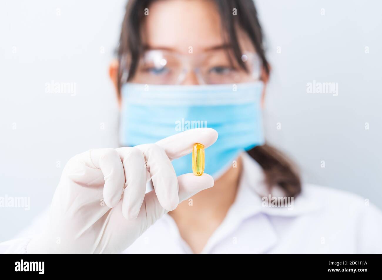 Close up Scientist hands putting in nitrile latex gloves holding Omega ...