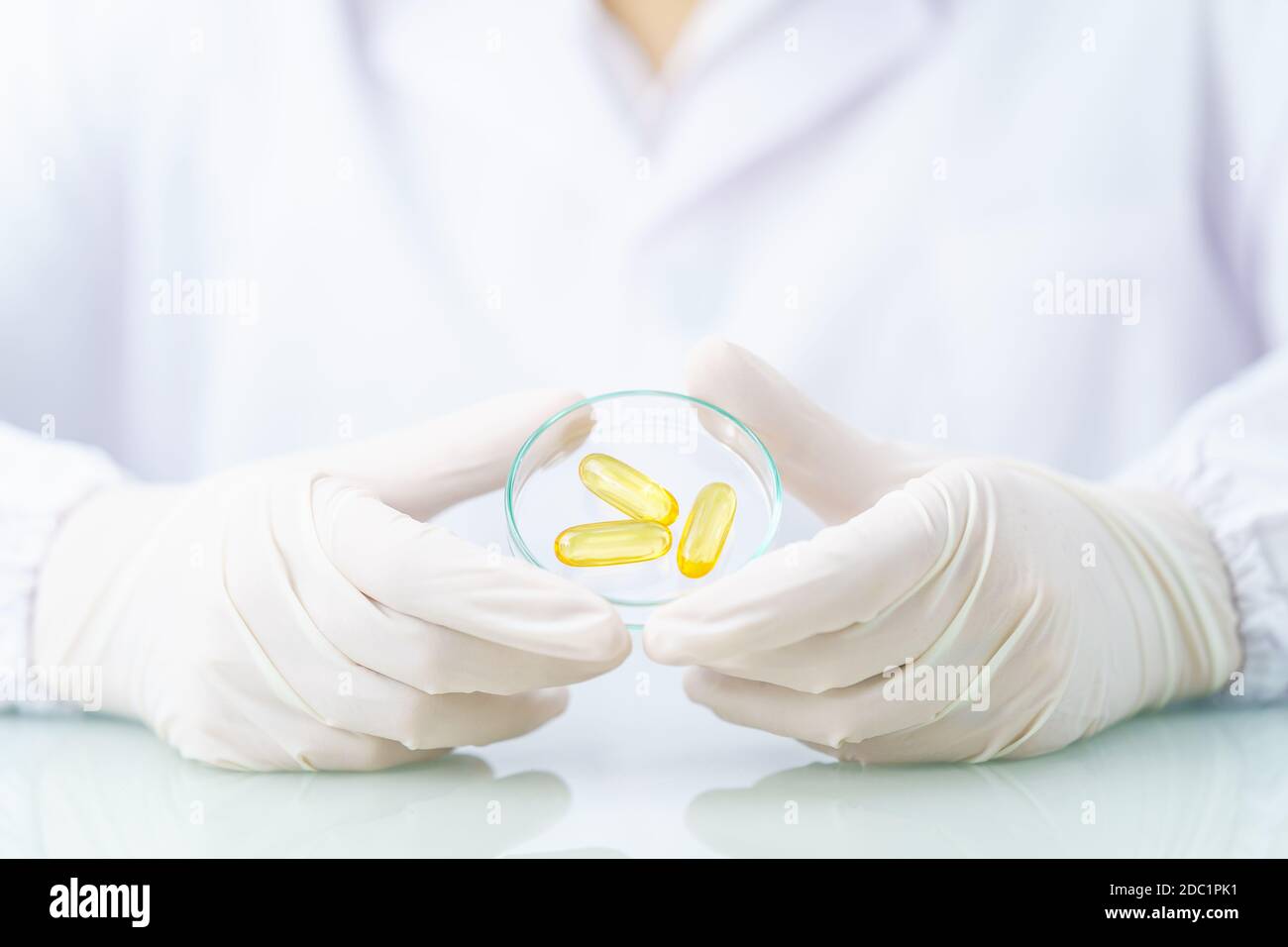 Close up Scientist hands putting in nitrile latex gloves holding Omega ...