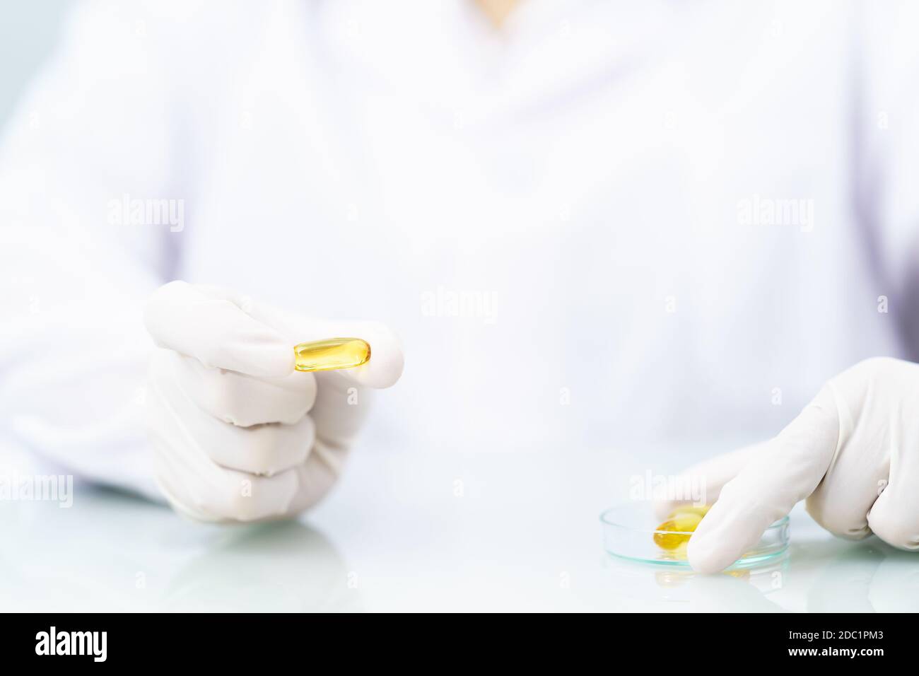 Close up Scientist hands putting in nitrile latex gloves holding Omega ...