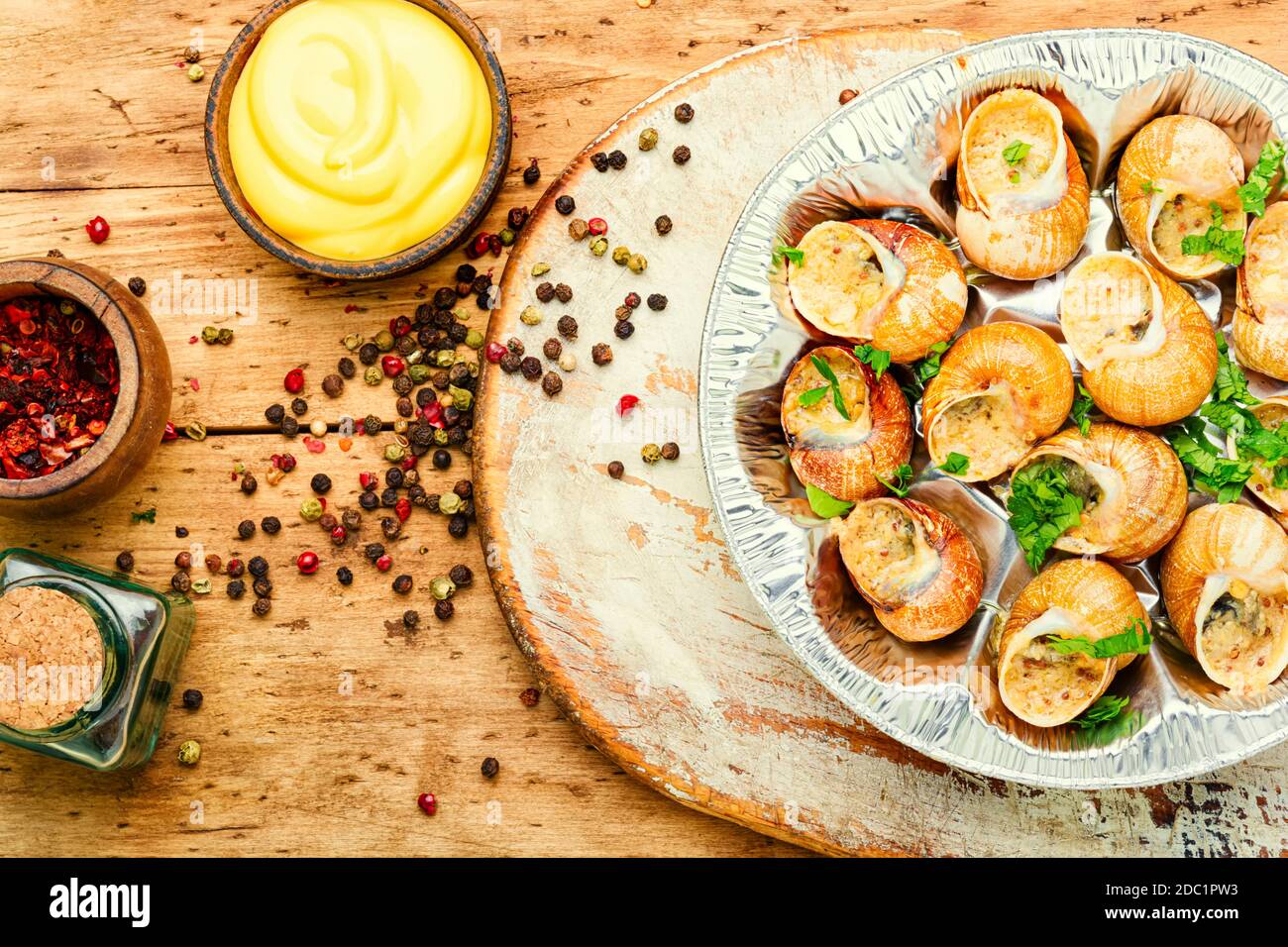 Escargots or snail with garlic butter and lime.Baked snails Stock Photo ...