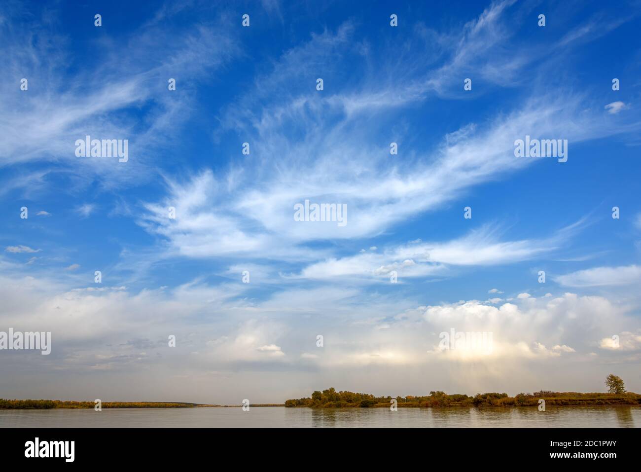 landscape on the river, blue sky with clouds, Bank edge with autumn ...