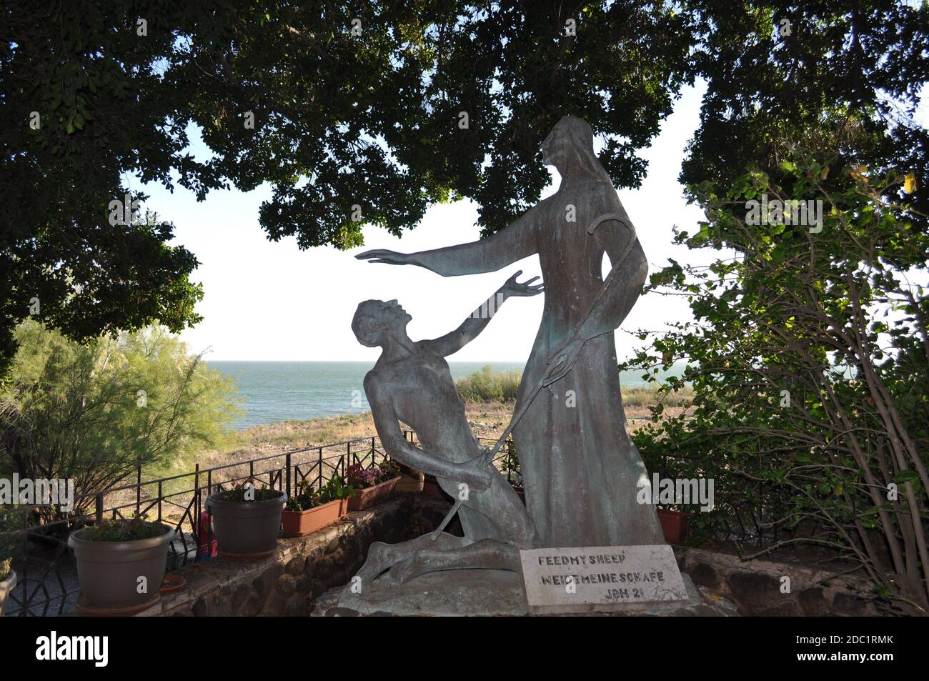 Statue depicting Christ & Peter overlooking Sea of Galilee Stock Photo ...