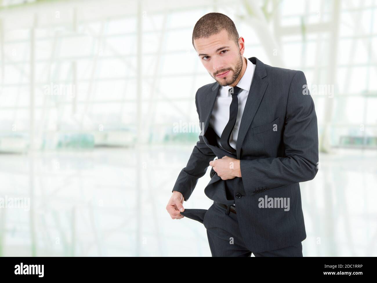 business man showing his empty pocket, at the office Stock Photo - Alamy