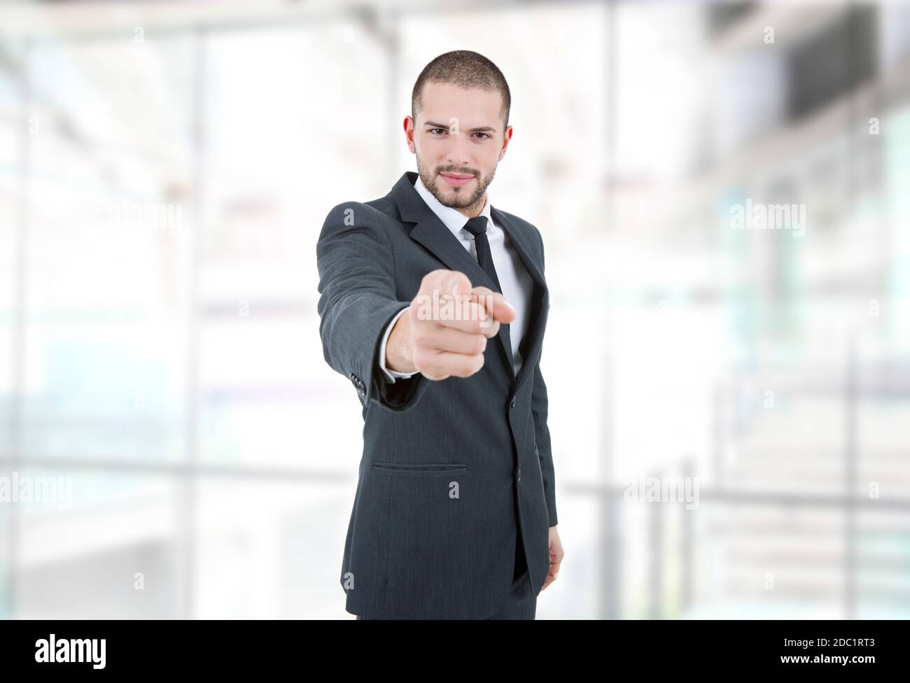 business man in a suit pointing with his finger at the office Stock ...